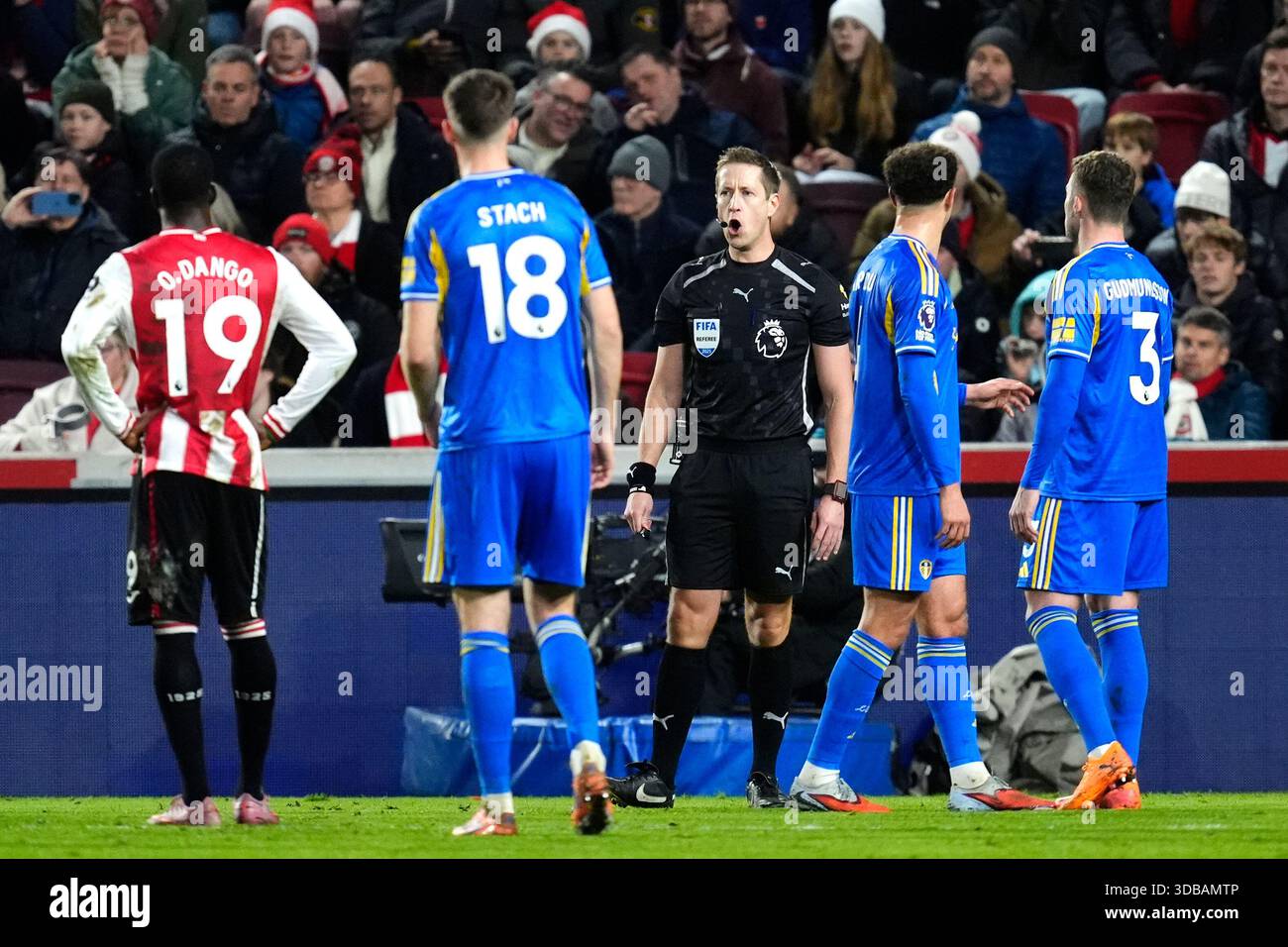 Referee John Brooks (centre) rules a goal offside following a on ...