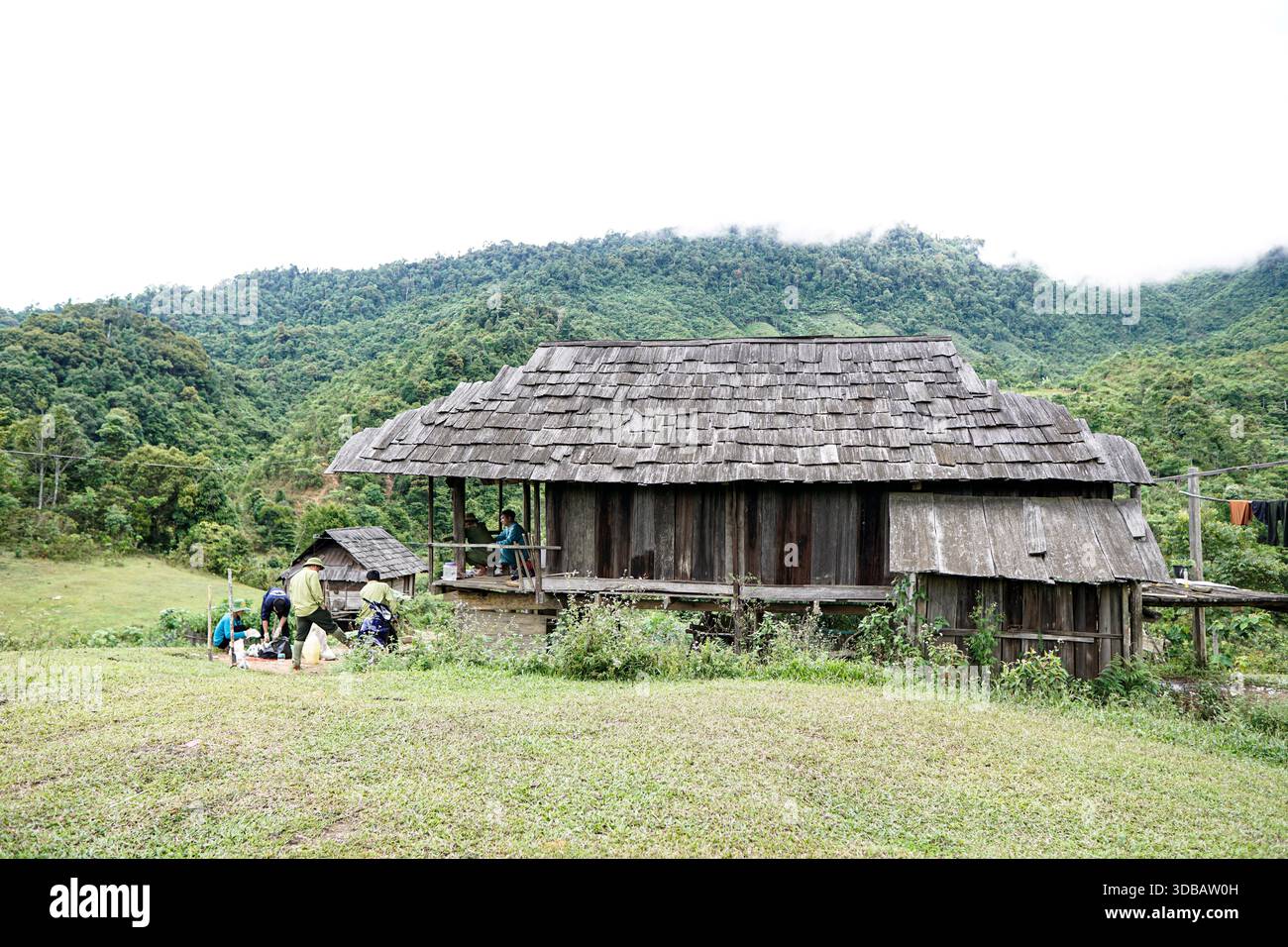 Traditional wooden stilt house with shingle roof in Northern Vietnam ...