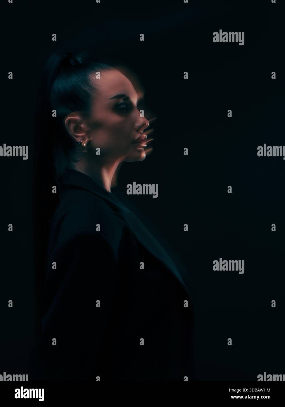 Cinematic side-profile portrait of woman emerging from darkness, with ...
