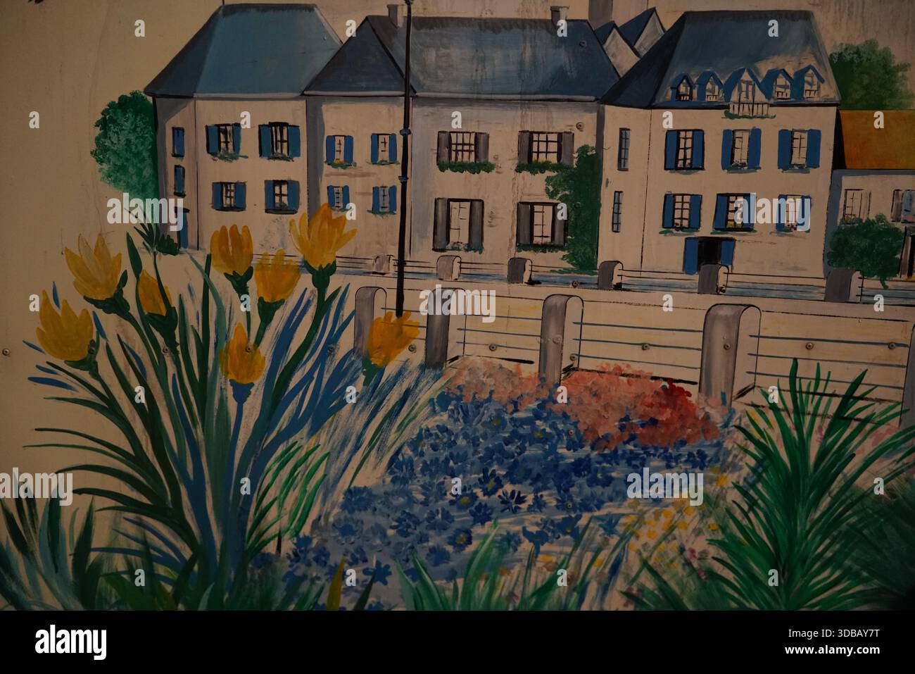 Painted mural depicting an illustrated townscape with houses and church ...