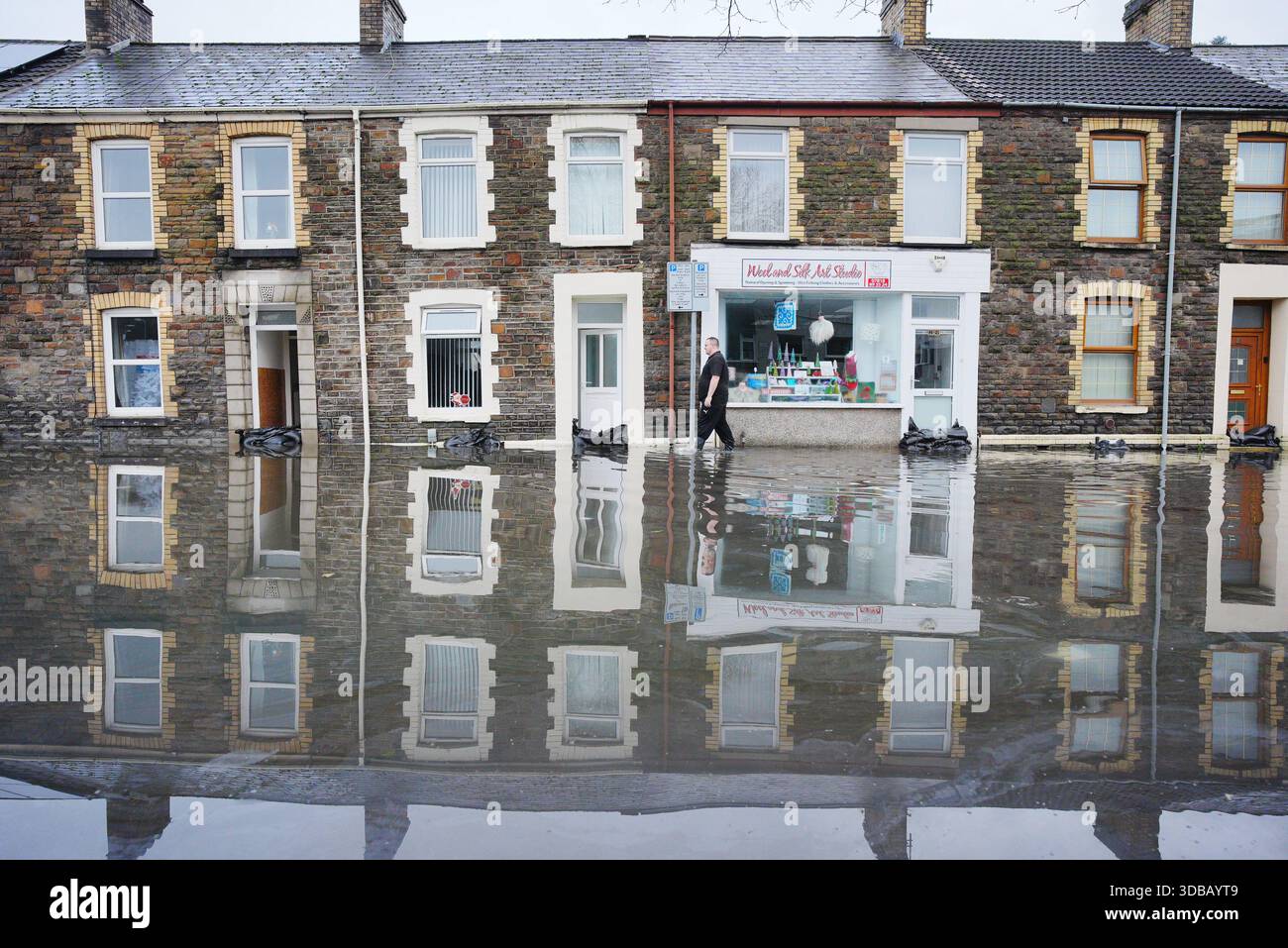 Flood water on Hunter Street in Briton Ferry, Neath. An amber rain ...