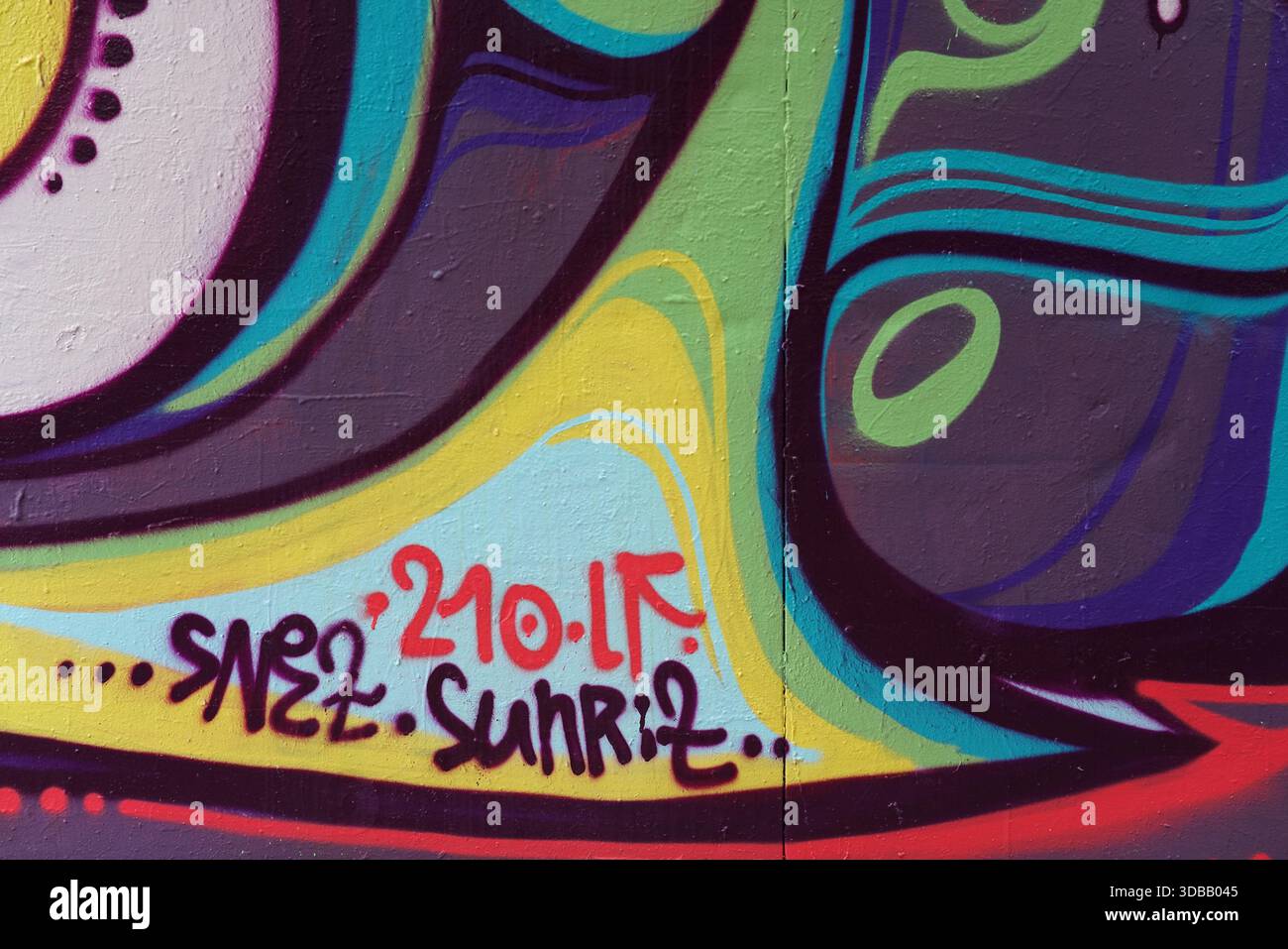 Graffiti wall detail featuring the artist SNEZ signature painted as ...
