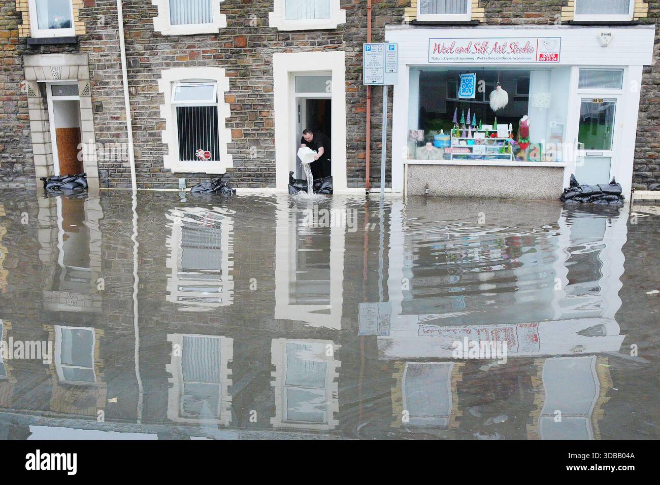 Flood water on Hunter Street in Briton Ferry, Neath. An amber rain ...