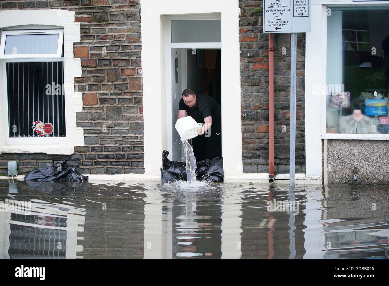 Flood water on Hunter Street in Briton Ferry, Neath. An amber rain ...