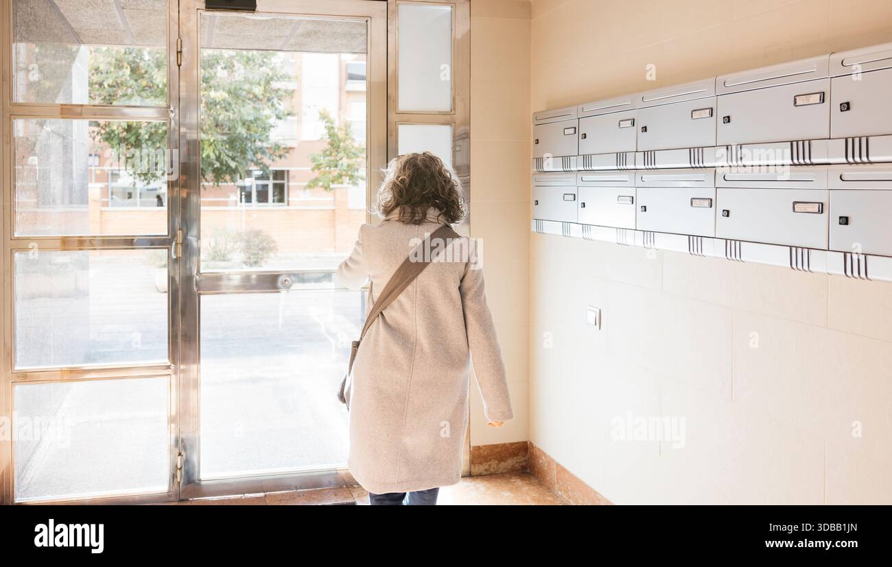 Woman walking inside residential building hi-res stock photography and ...