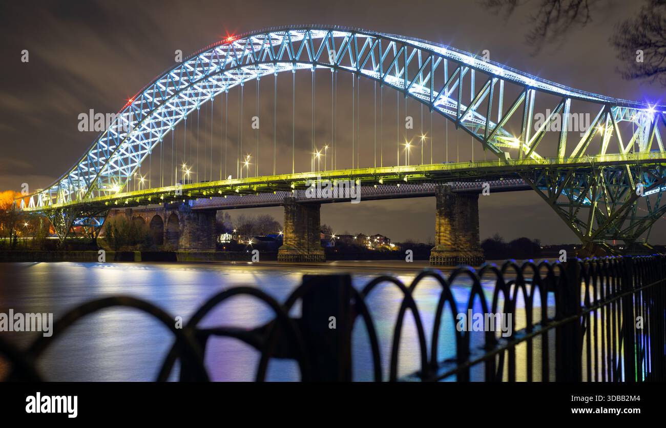 The Silver Jubilee Bridge, crossing the river Mersey, joining Widnes to ...