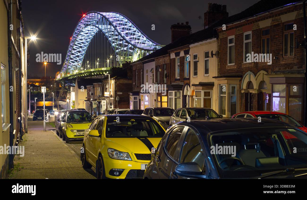 Mersey Road, West Bank, Widnes, with the Silver Jubilee Bridge towering ...