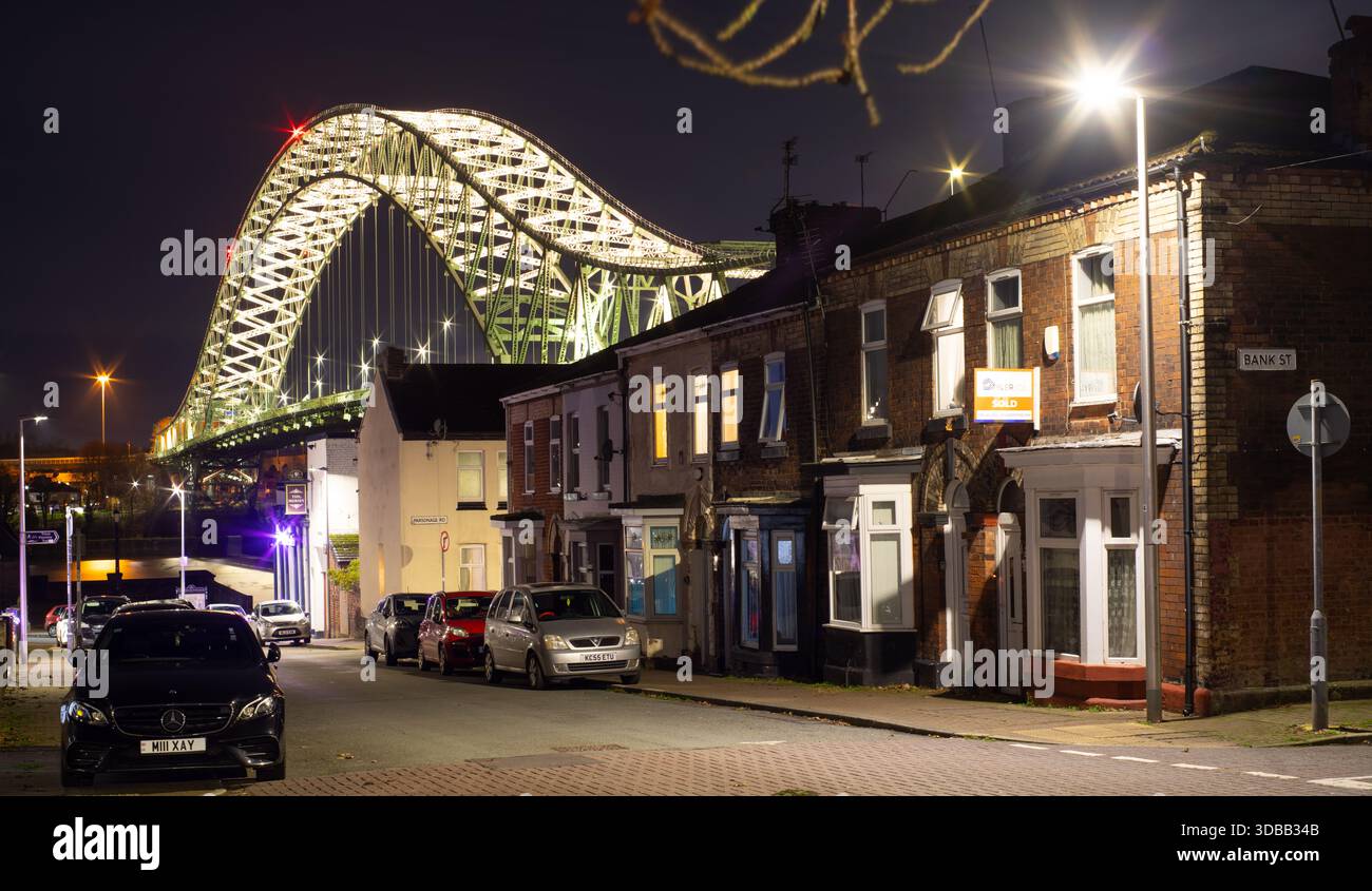 Mersey Road, West Bank, Widnes, with the Silver Jubilee Bridge towering ...