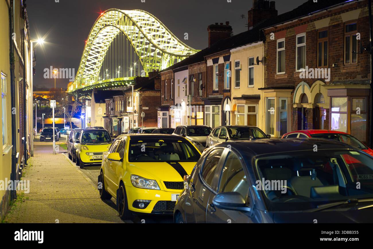 Mersey Road, West Bank, Widnes, with the Silver Jubilee Bridge towering ...