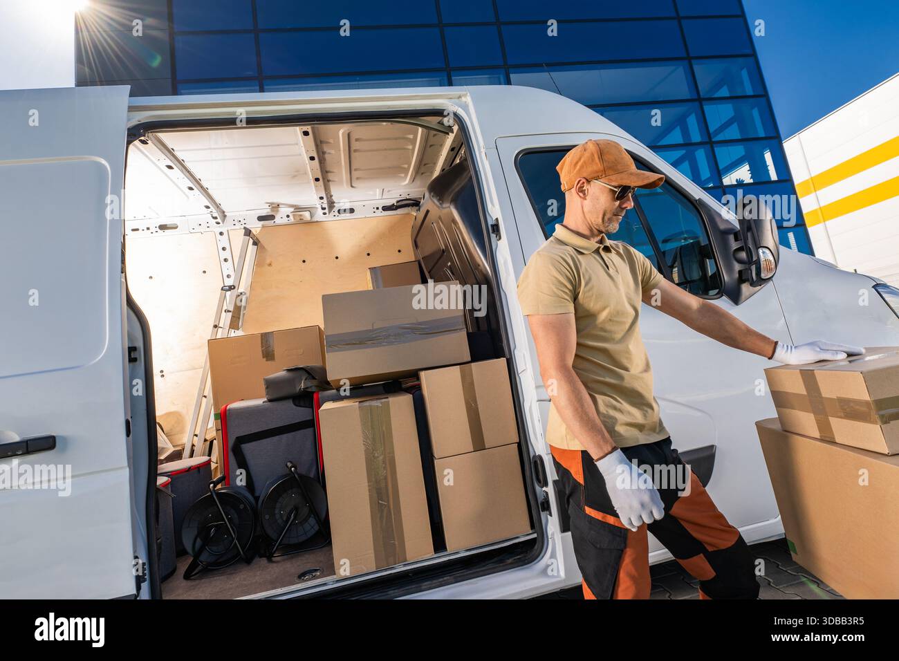 Worker hands out boxes hi-res stock photography and images - Alamy