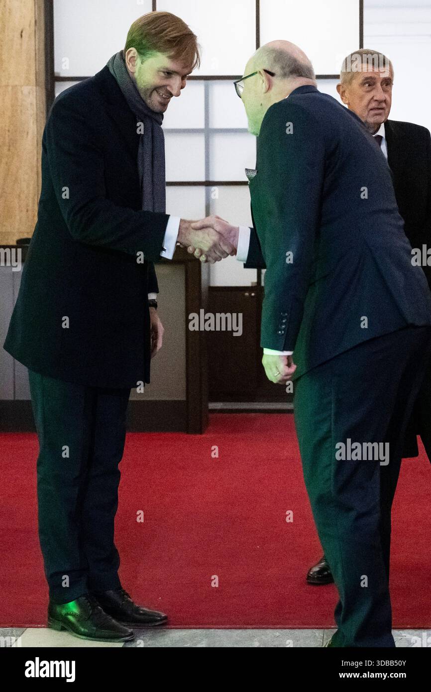 Outgoing Health Minister Vlastimil Valek (middle) welcomes Prime Minister Andrej Babis (right ...