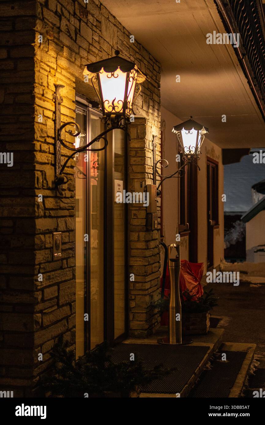 A charming scene from a quiet Austrian village at night. Warm light ...