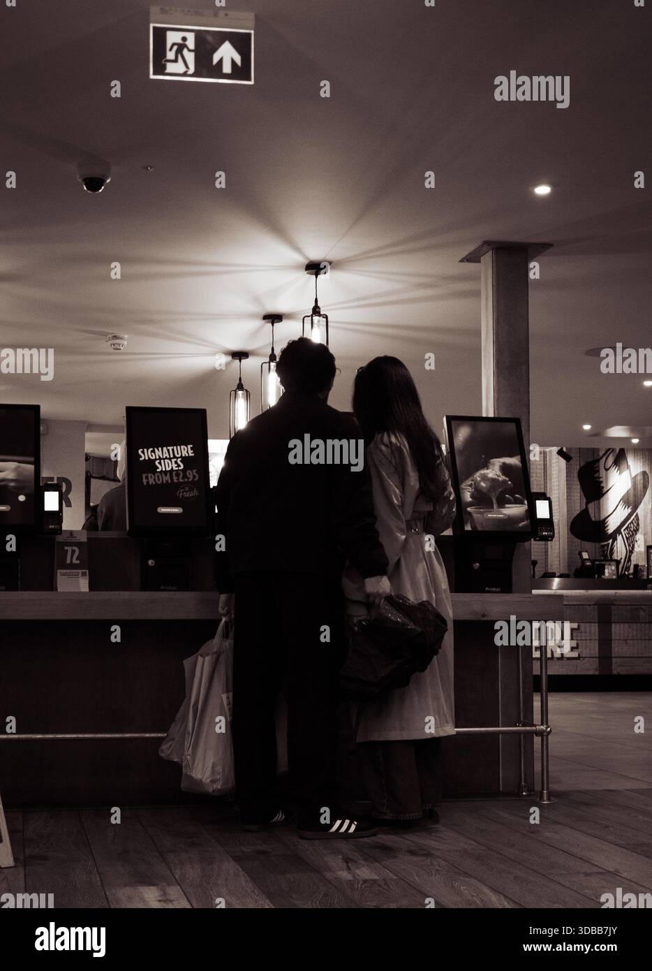 Two people shopping in central London Stock Photo - Alamy