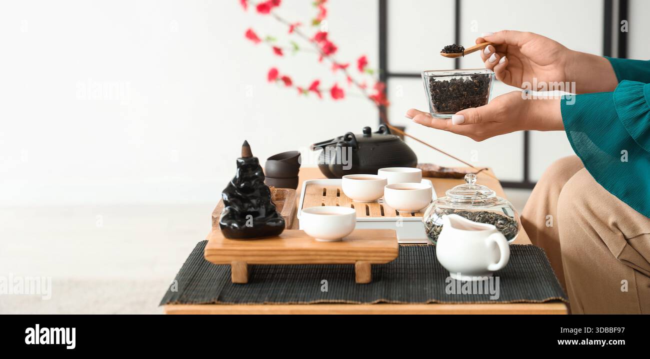 Woman brewing black tea hi-res stock photography and images - Alamy