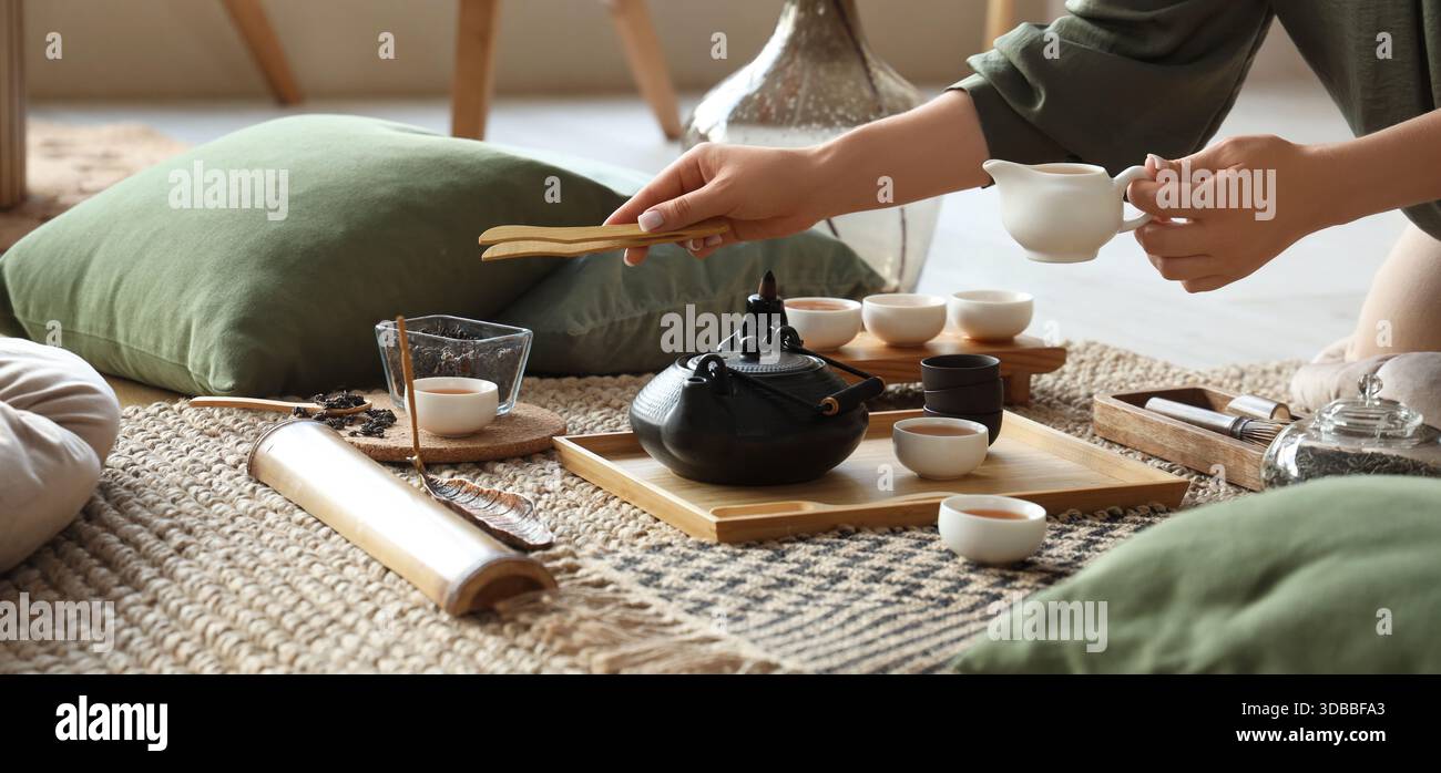 Woman brewing black tea hi-res stock photography and images - Alamy