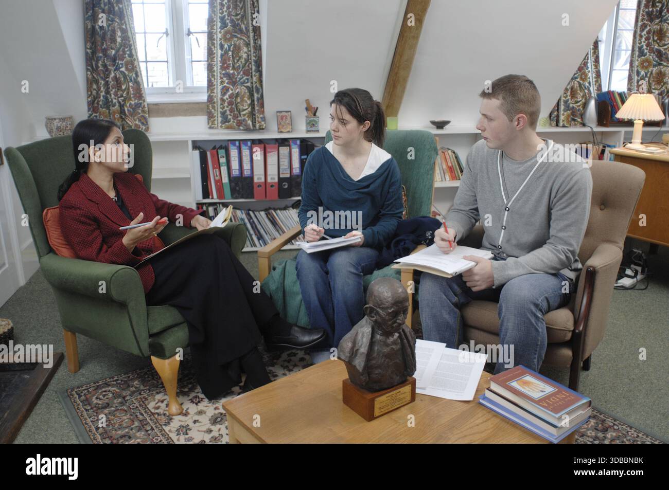 Cambridge University students in a tutorial with their professor Stock ...