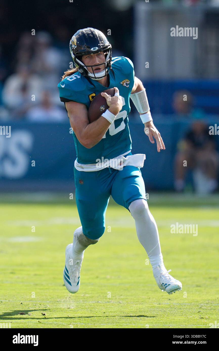 Jacksonville Jaguars quarterback Trevor Lawrence runs against the New ...