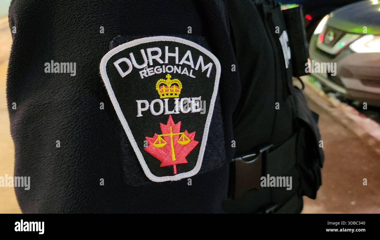 A Durham Regional Police officer's logo emblem is shown at a ...