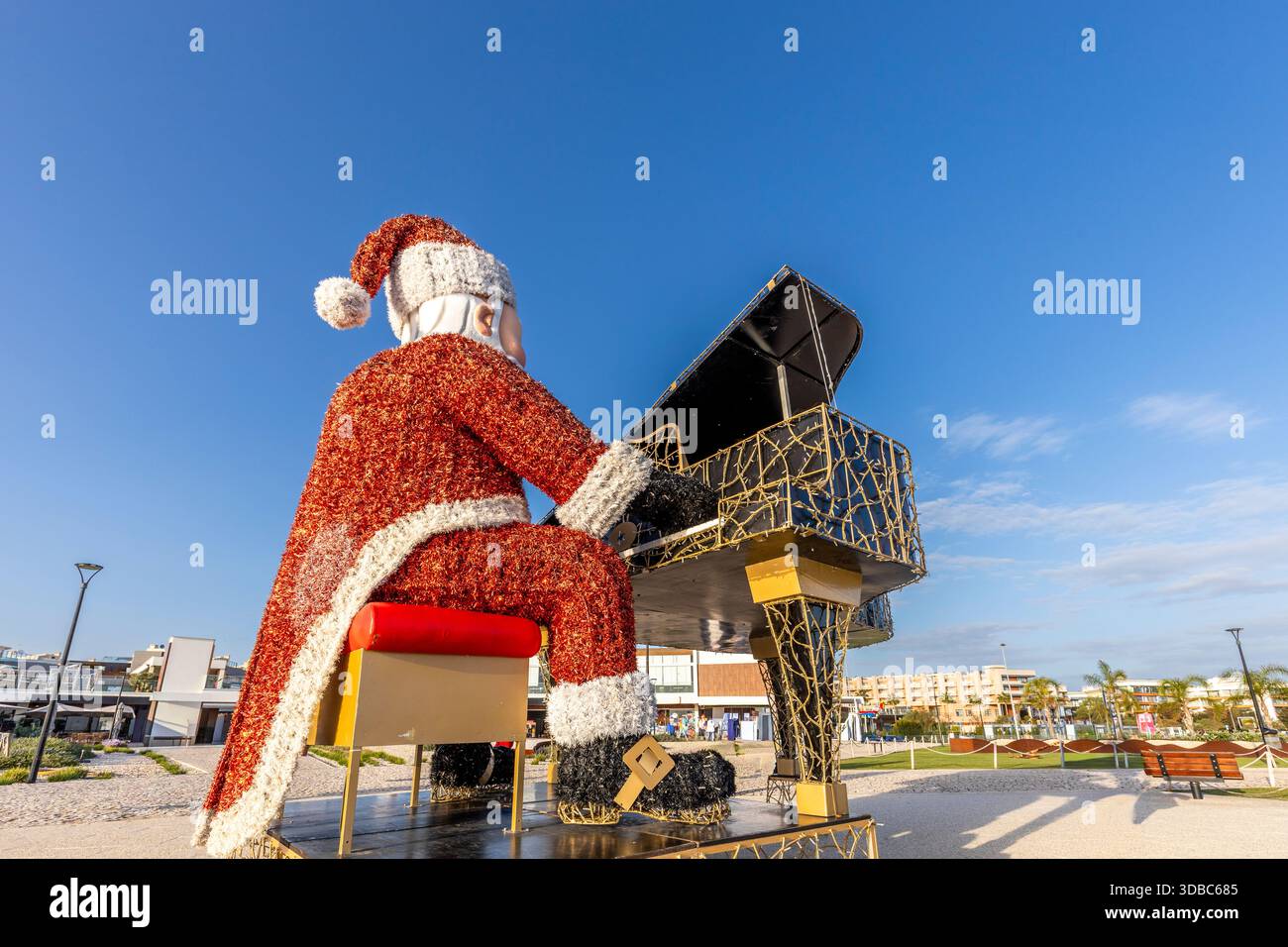 Festive outdoor Christmas decoration featuring a Santa Claus figure ...