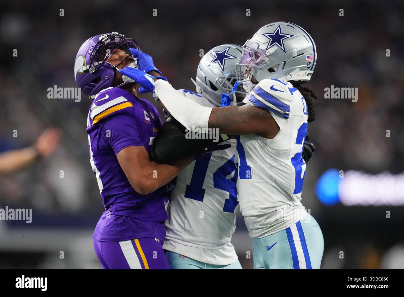 Dallas Cowboys cornerback Caelen Carson, right, fights with Minnesota ...
