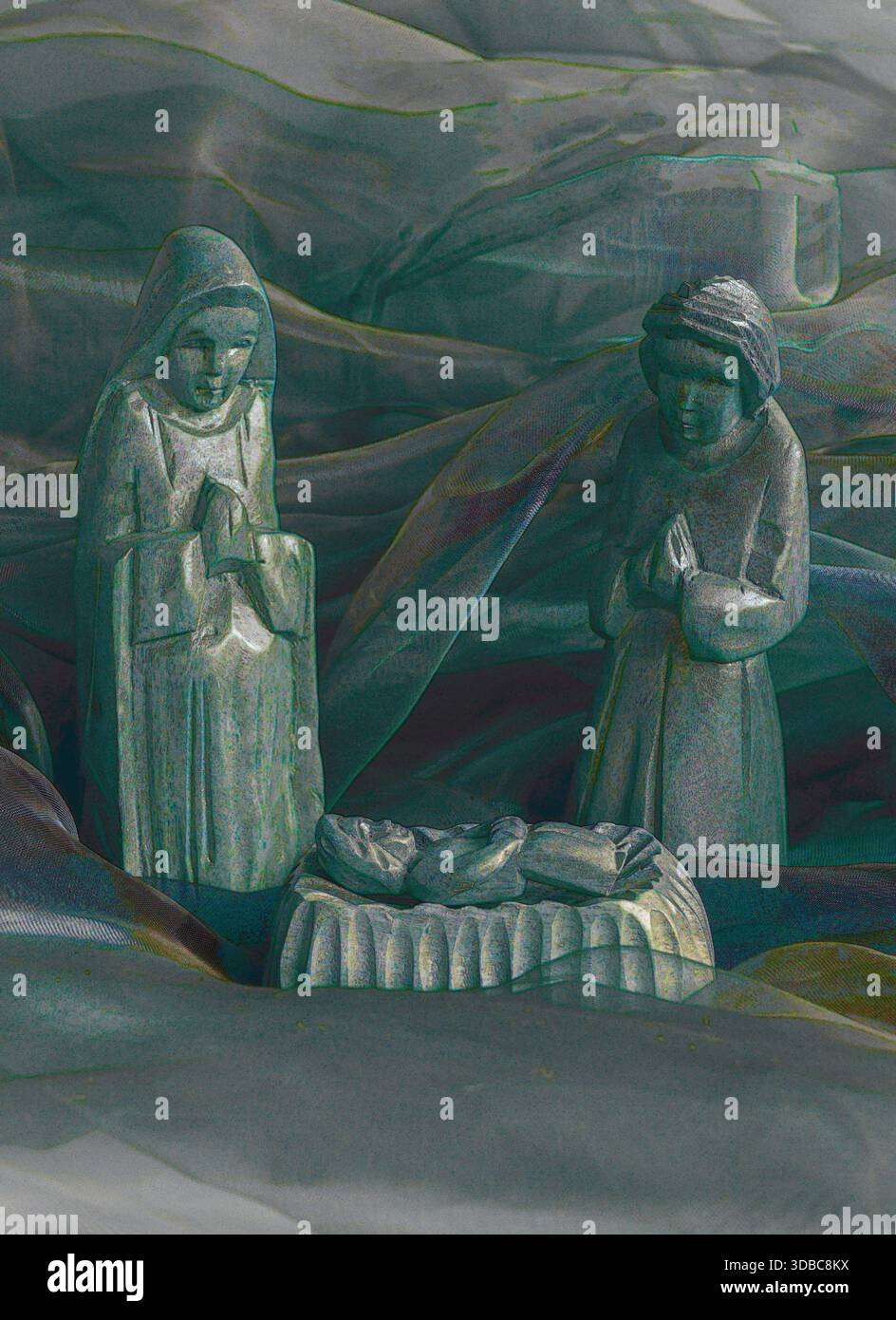 Mary, Joseph & baby Jesus in a manger are sculpted figures of wood in ...