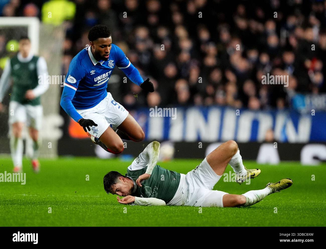 Rangers' Youssef Chermiti is fouled by Hibernian's Jamie McGrath (right ...