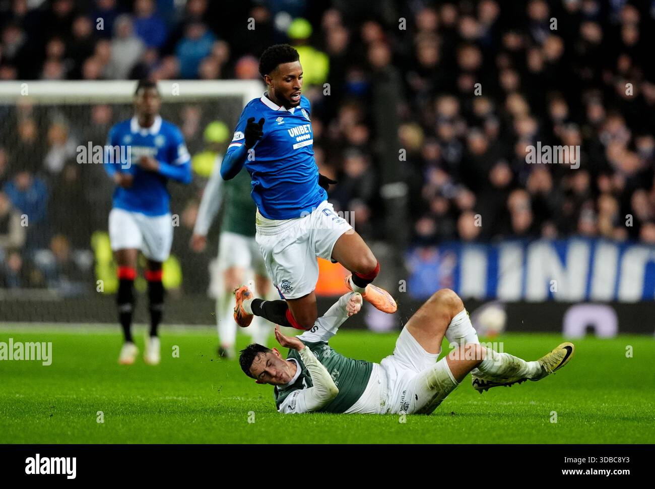 Rangers' Youssef Chermiti is fouled by Hibernian's Jamie McGrath (right ...