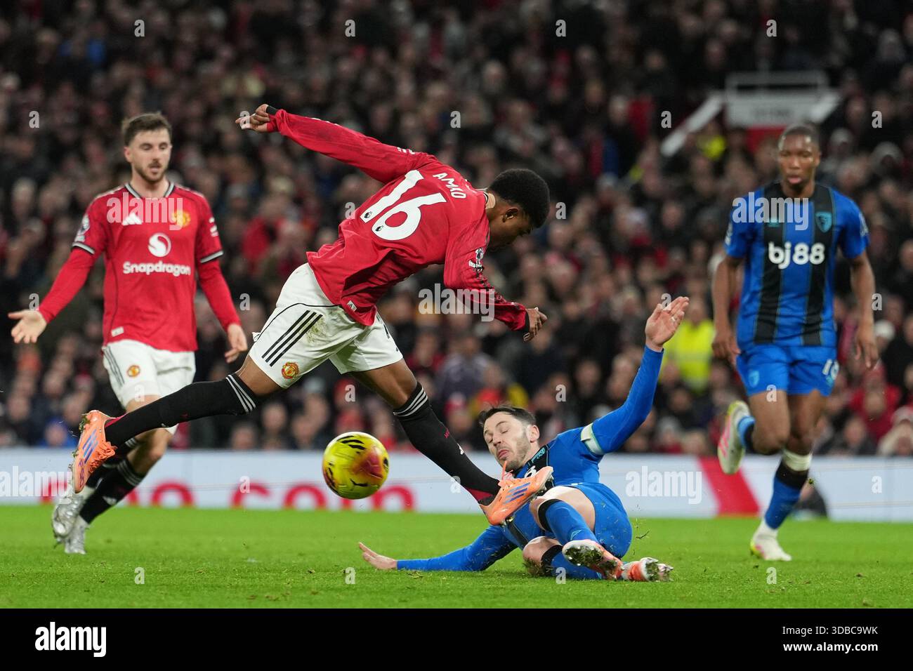 Manchester United's Amad Diallo shoots by Bournemouth's Adam Smith ...