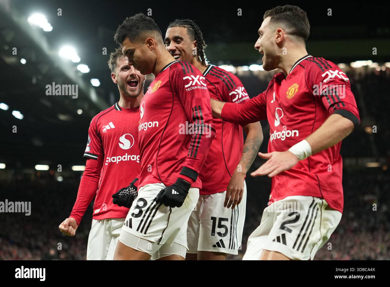 Manchester United players celebrate after a goal during a Premier ...