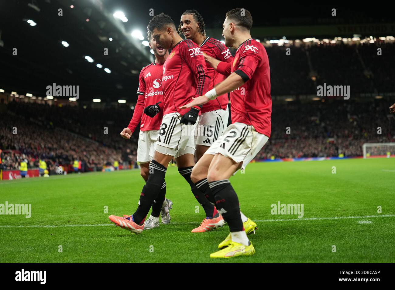 Manchester United players celebrate after a goal during a Premier ...
