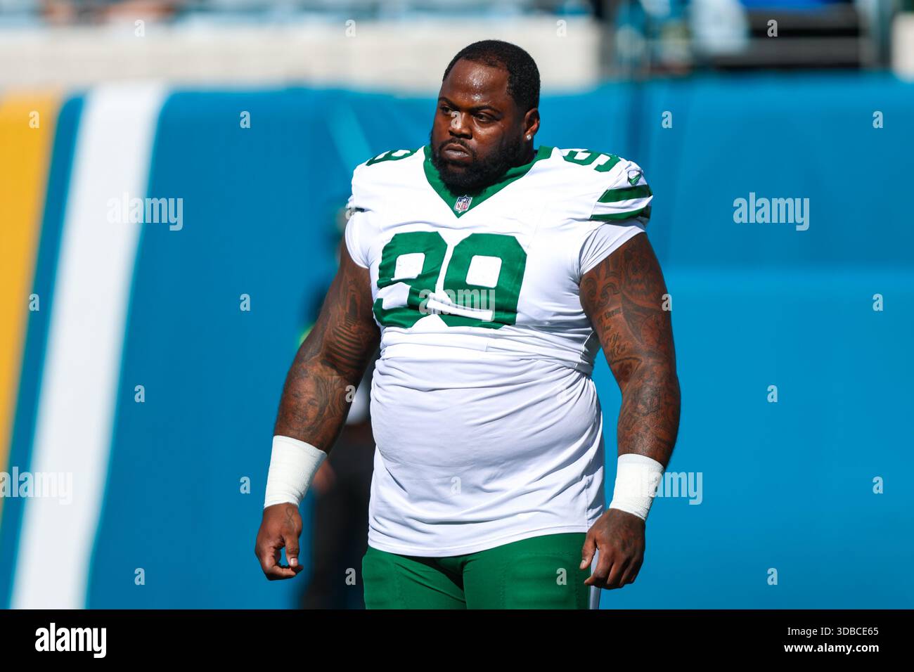 New York Jets defensive tackle Khalen Saunders (99) warms up before an ...