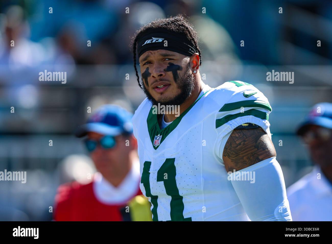 New York Jets linebacker Jermaine Johnson (11) walks the sideline ...