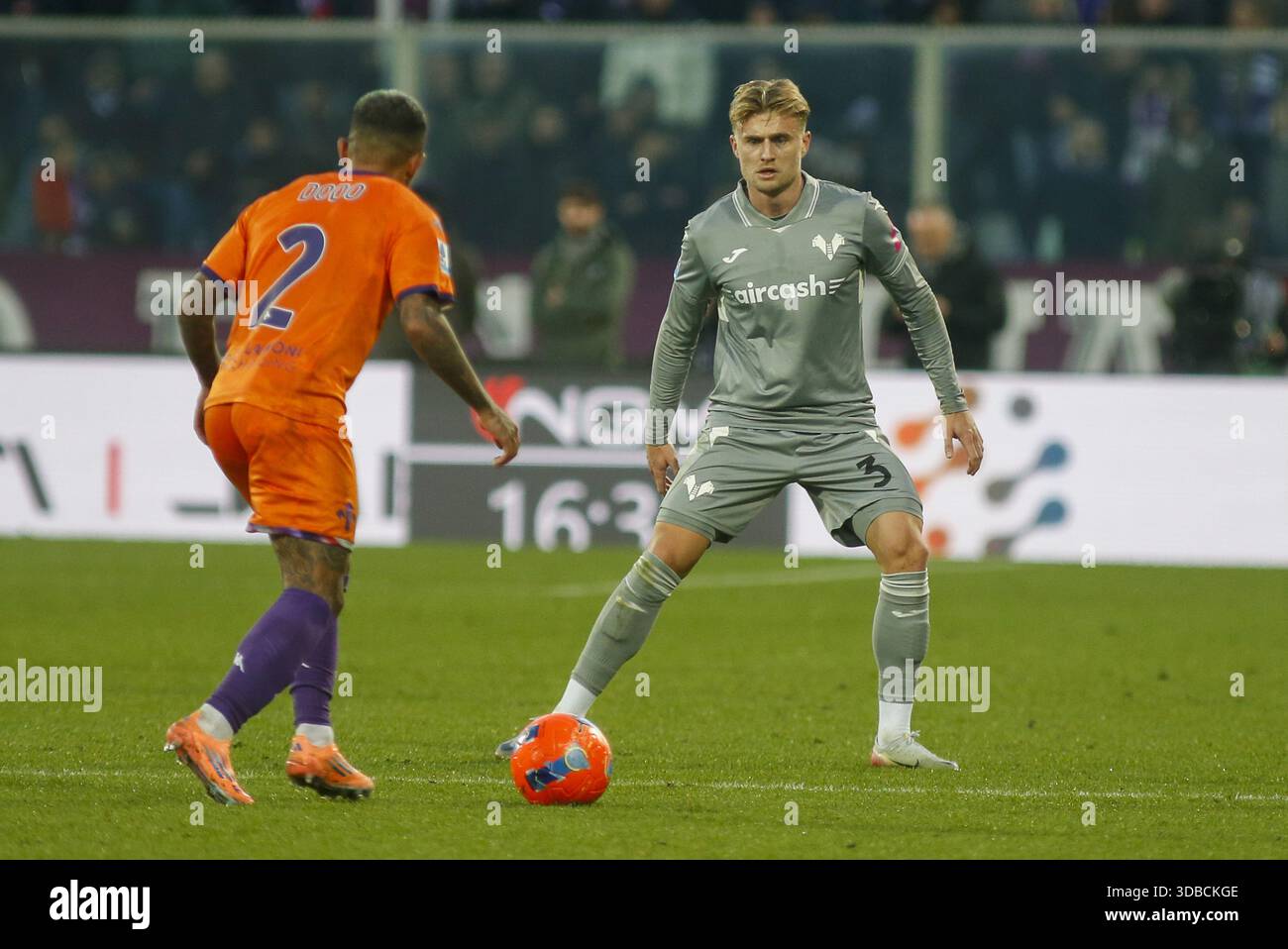Martin Frese of Hellas Verona FC competes for the ball with Dodo of ACF ...
