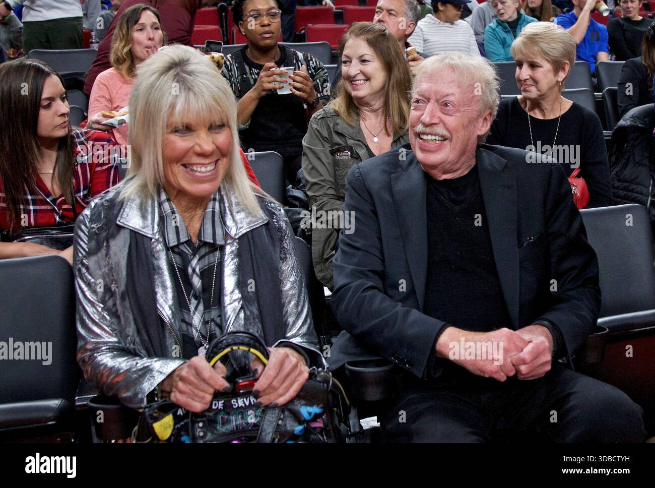 FILE - Phil Knight, right, and Penny Knight, watch the first half of an ...