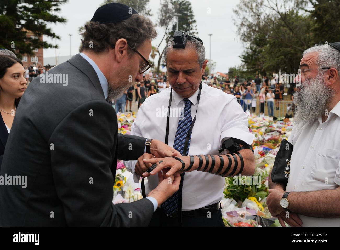 The Israeli Ambassador to Australia Amir Maimon, center, prepares to ...