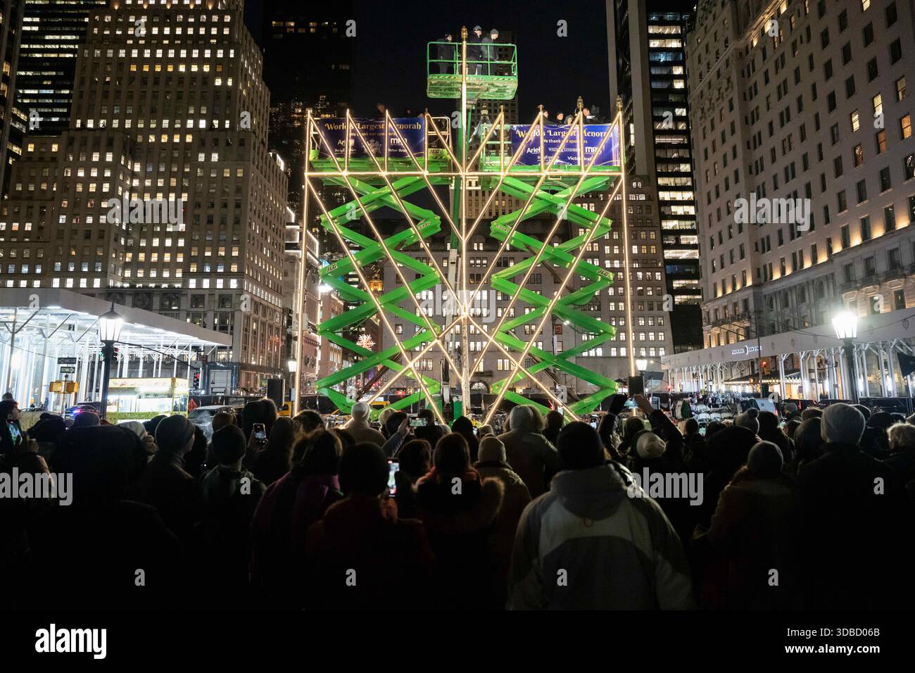 People watch the lighting of the world's largest menorah on Fifth ...