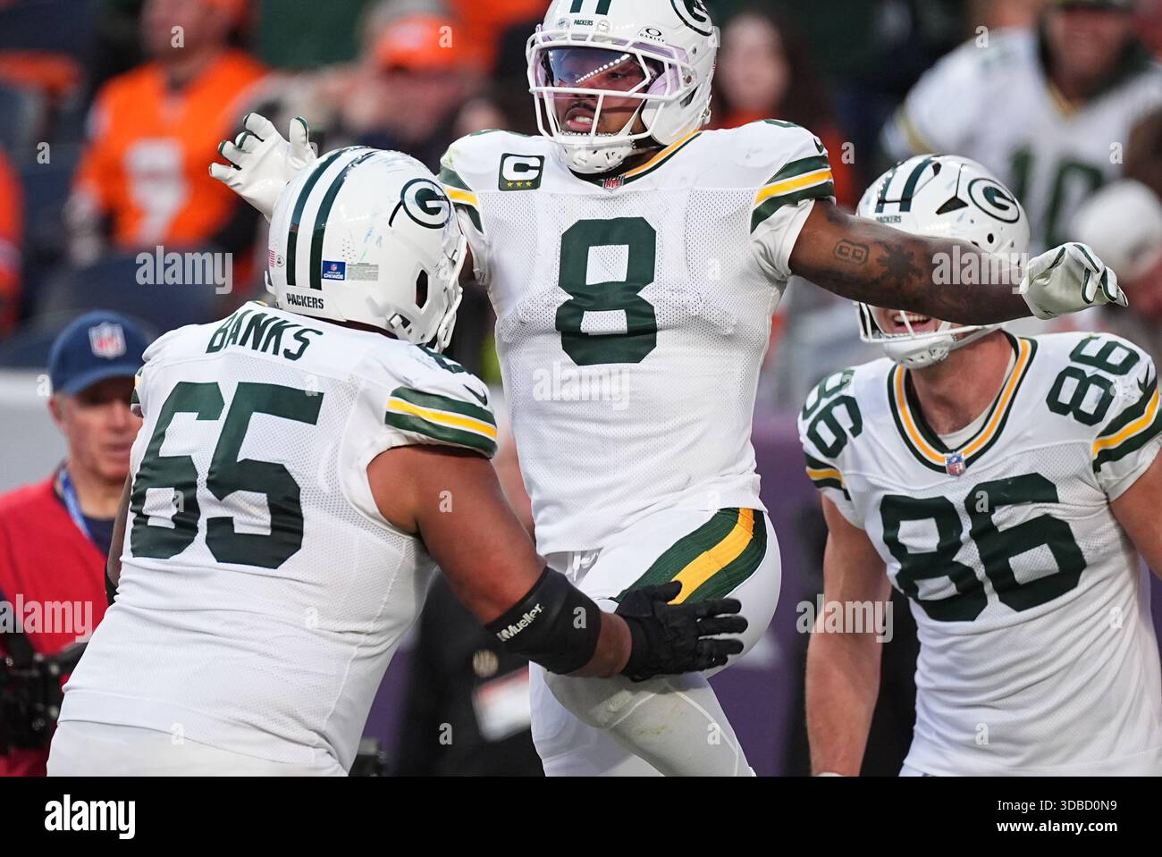 Green Bay Packers running back Josh Jacobs (8) celebrates after running ...
