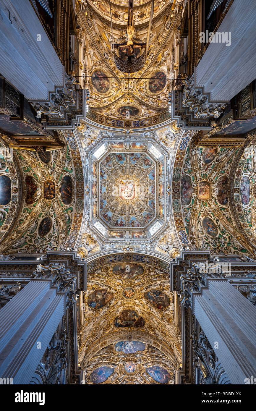 Bergamo, Italy - Jul 30, 2025: Baroque stucco, gilded coffers, and ...