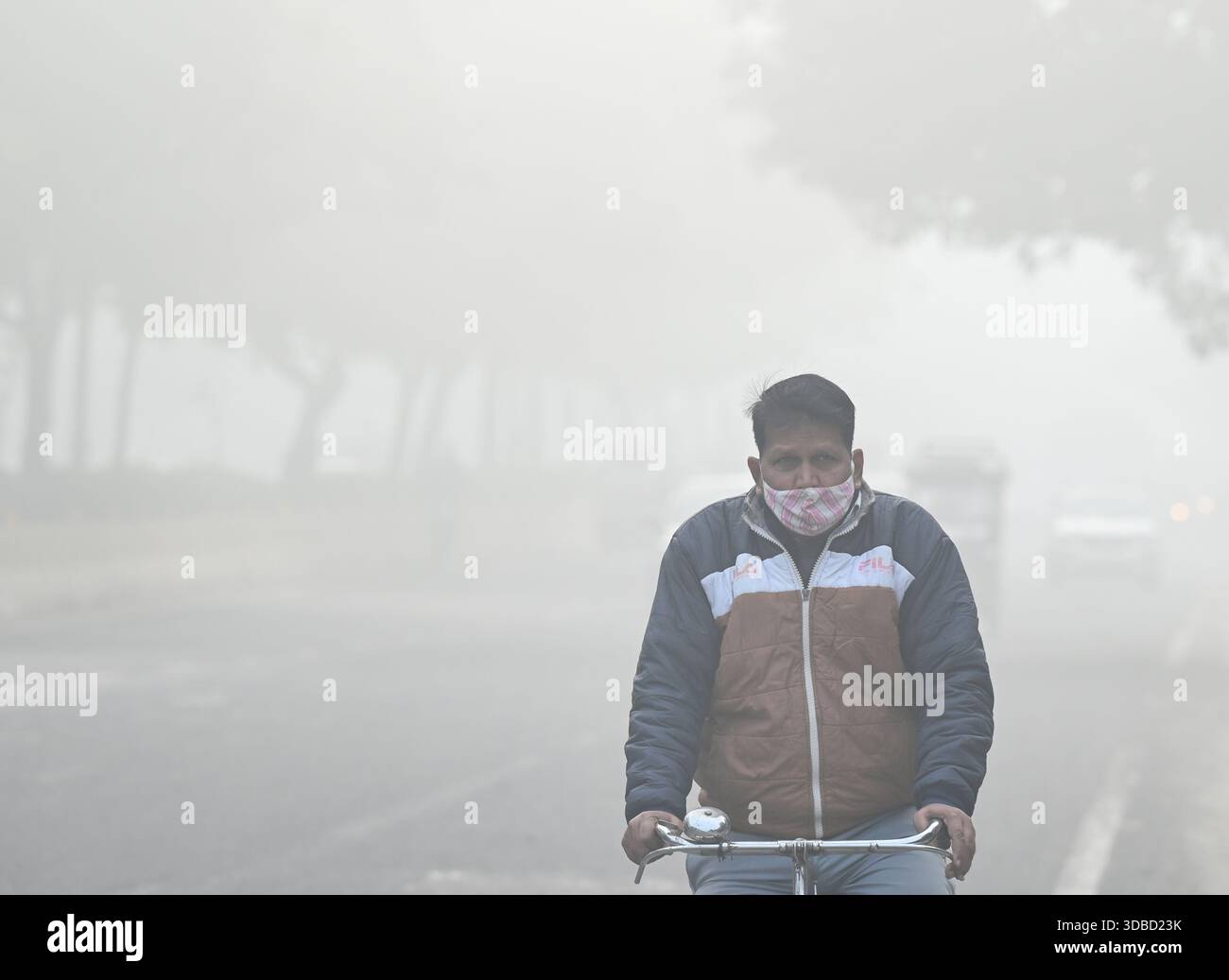 NOIDA, INDIA - DECEMBER 15: Commuters ventured out on a foggy and cool ...