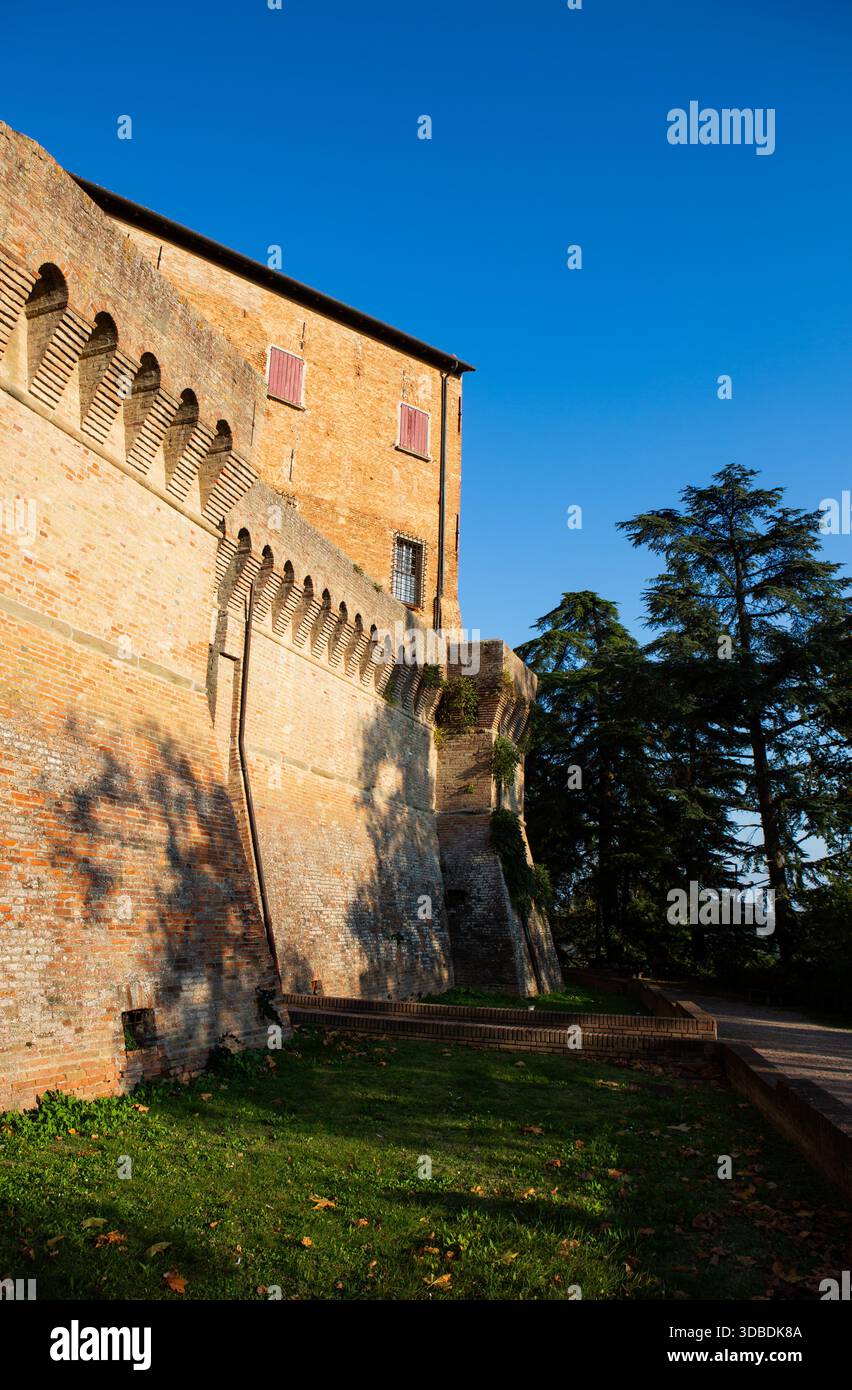 Majestic medieval fortress photographed from below showing red shutters ...