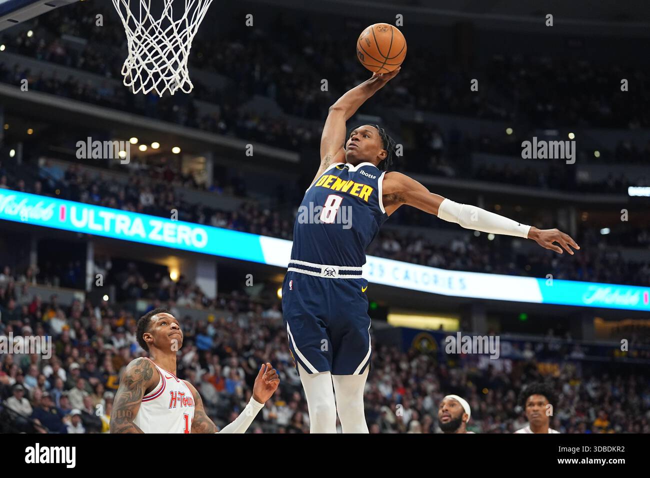 Denver Nuggets guard Peyton Watson (8) goes up to dunk over Houston ...