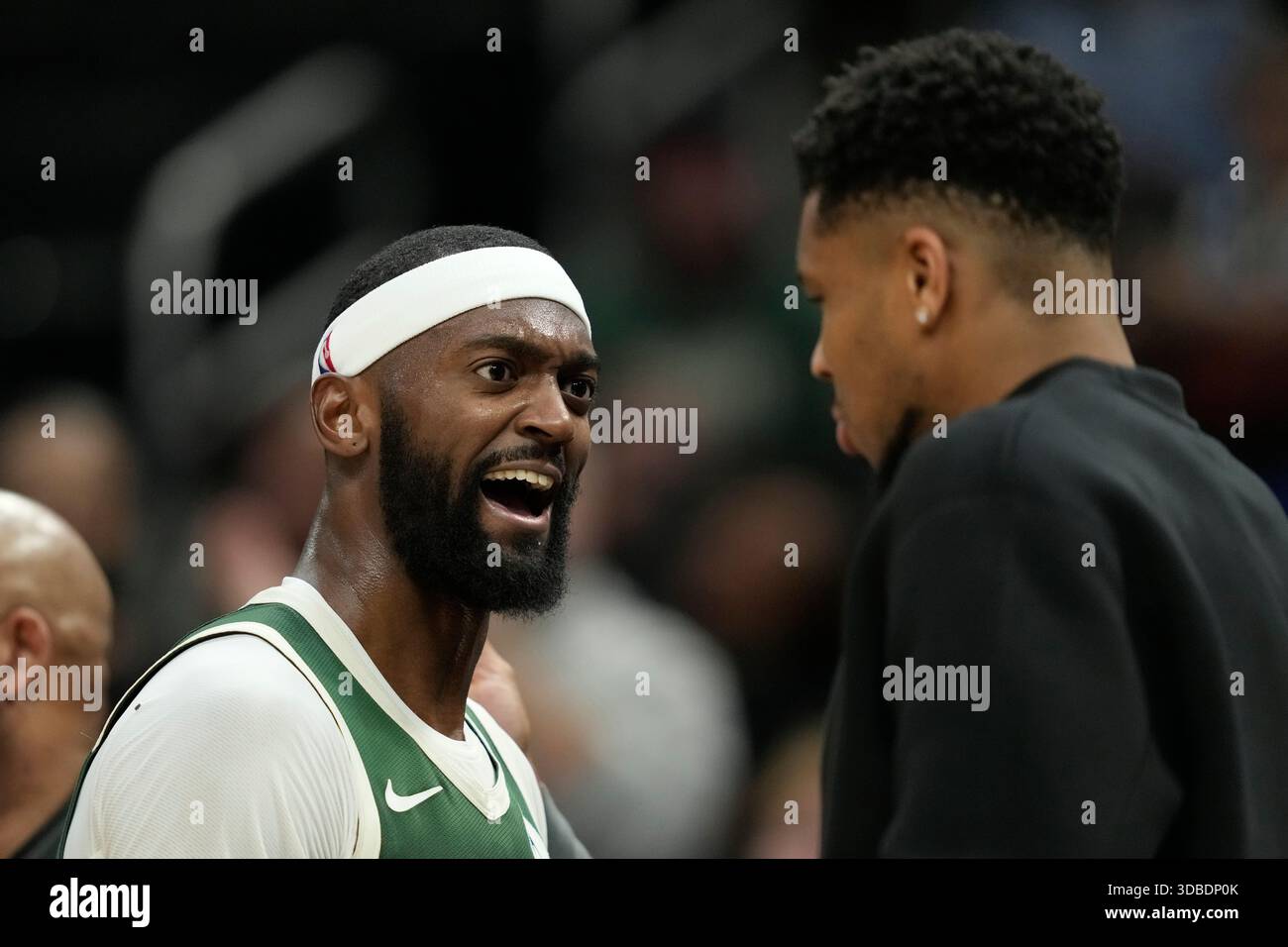 Milwaukee Bucks' Bobby Portis smiles with Giannis Antetokounmpo during ...
