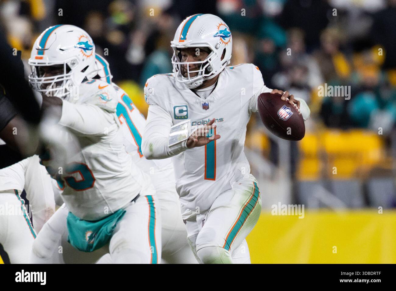 Miami Dolphins quarterback Tua Tagovailoa (1) looks to pass during an ...