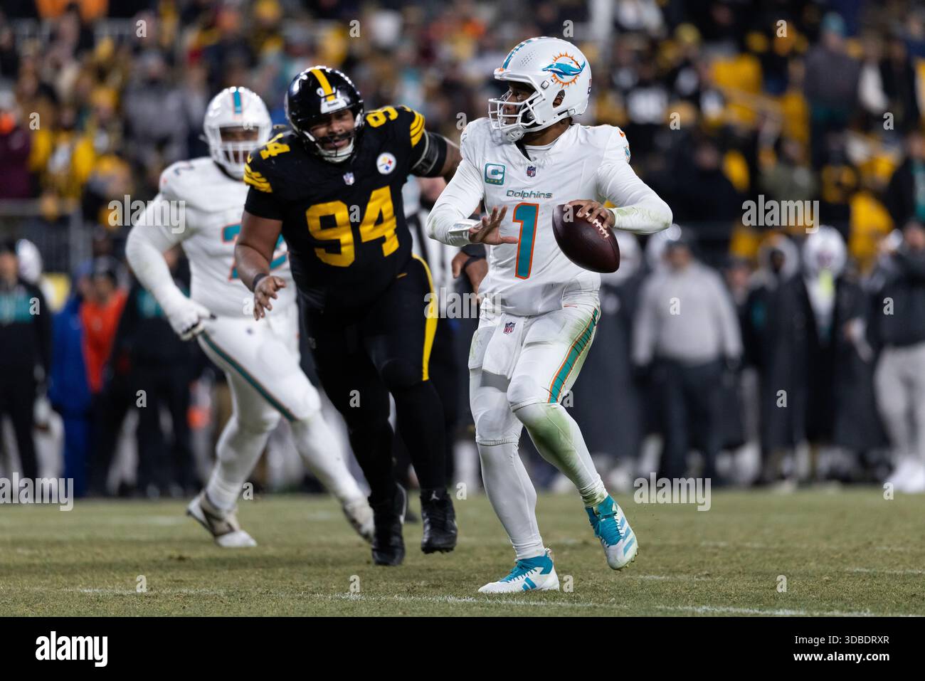 Miami Dolphins quarterback Tua Tagovailoa (1) looks to pass during an ...
