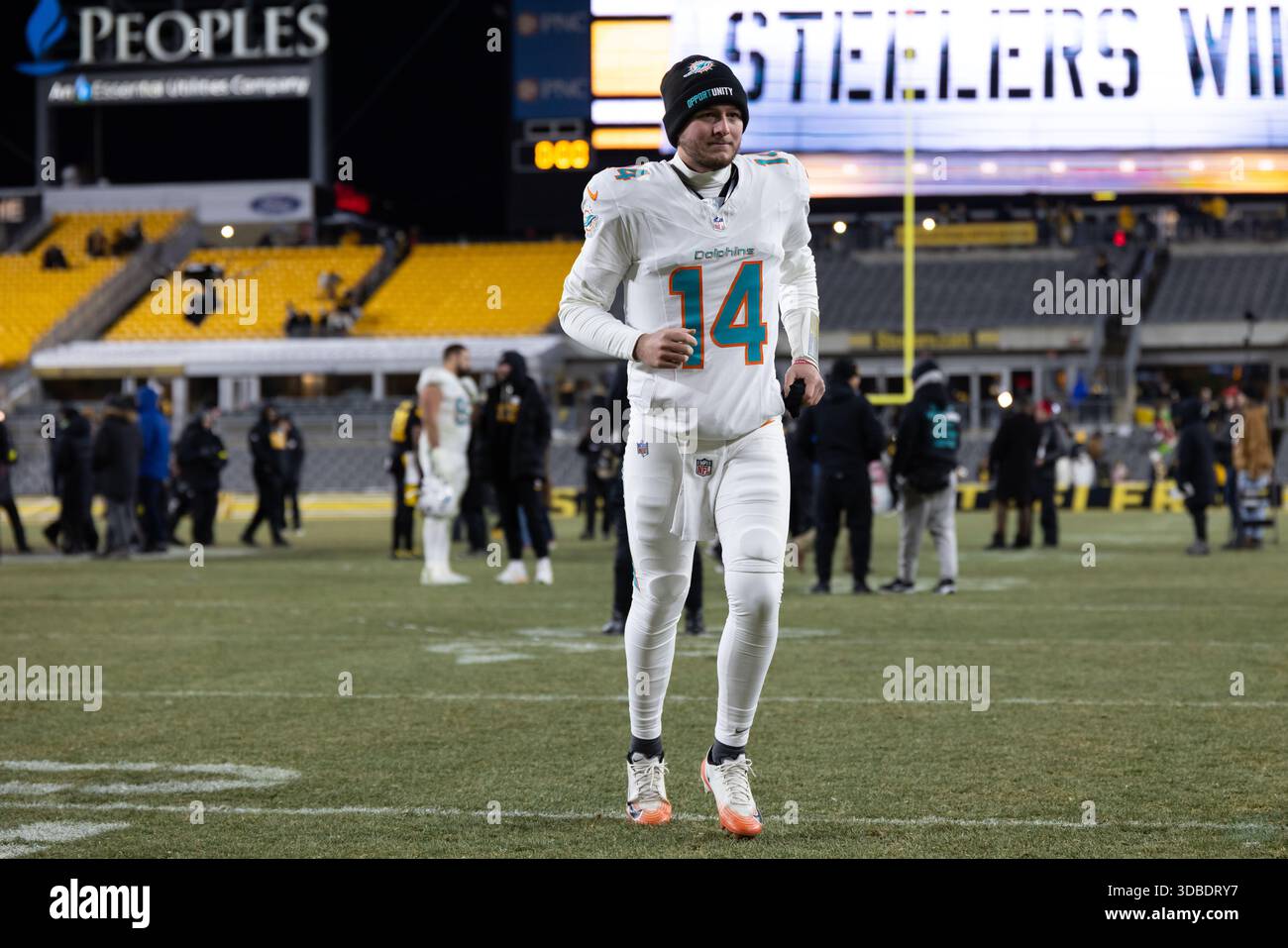 Miami Dolphins quarterback Quinn Ewers (14) runs off the field after an ...