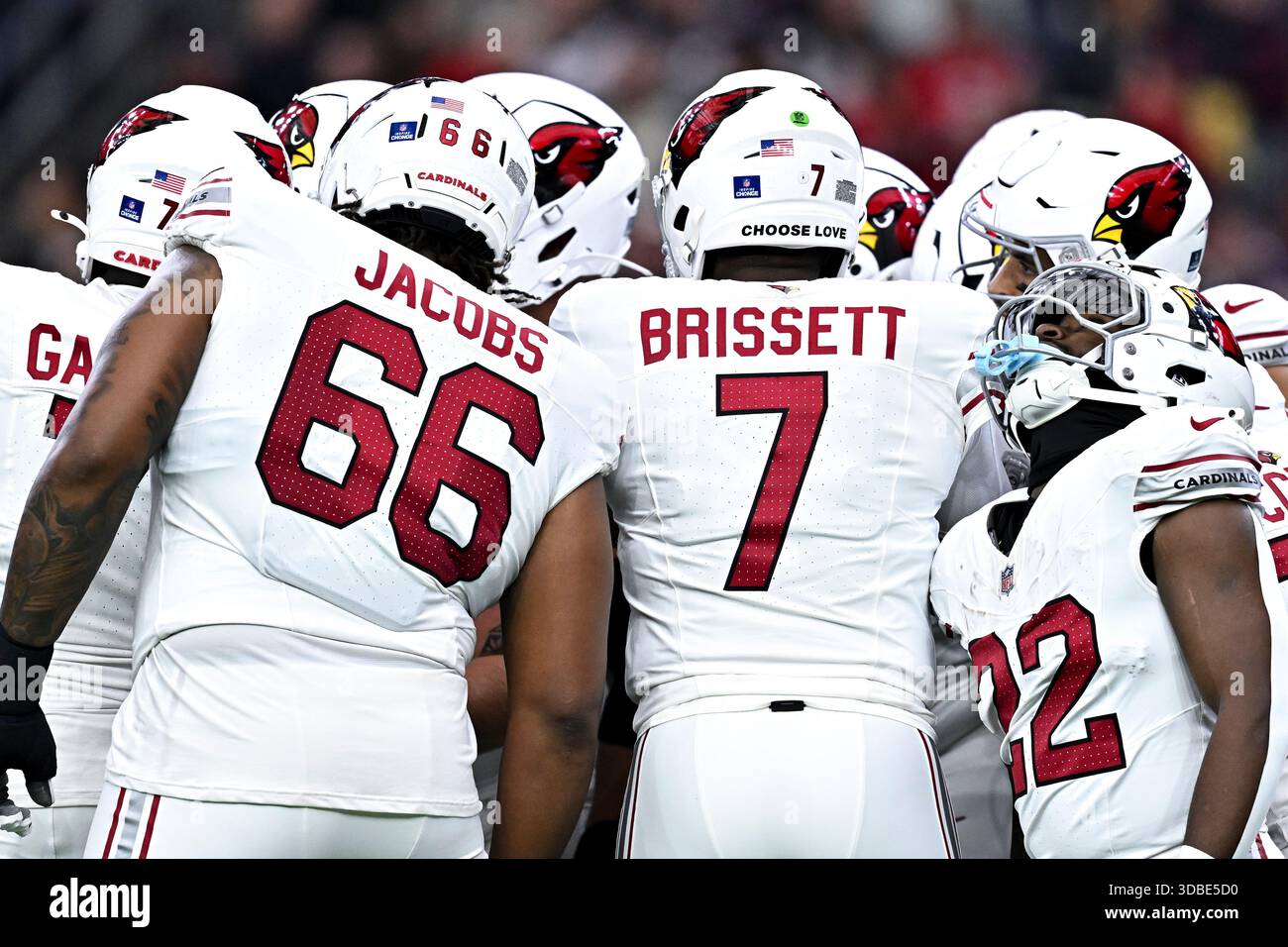 Arizona Cardinals quarterback Jacoby Brissett (7) stands in the huddle ...