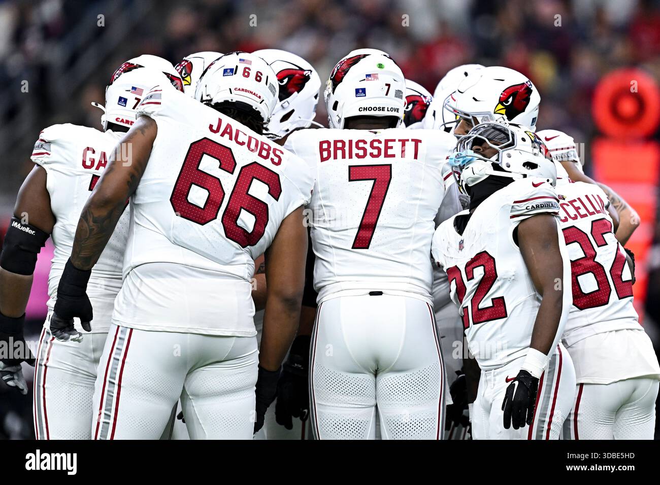 Arizona Cardinals quarterback Jacoby Brissett (7) stands in the huddle ...