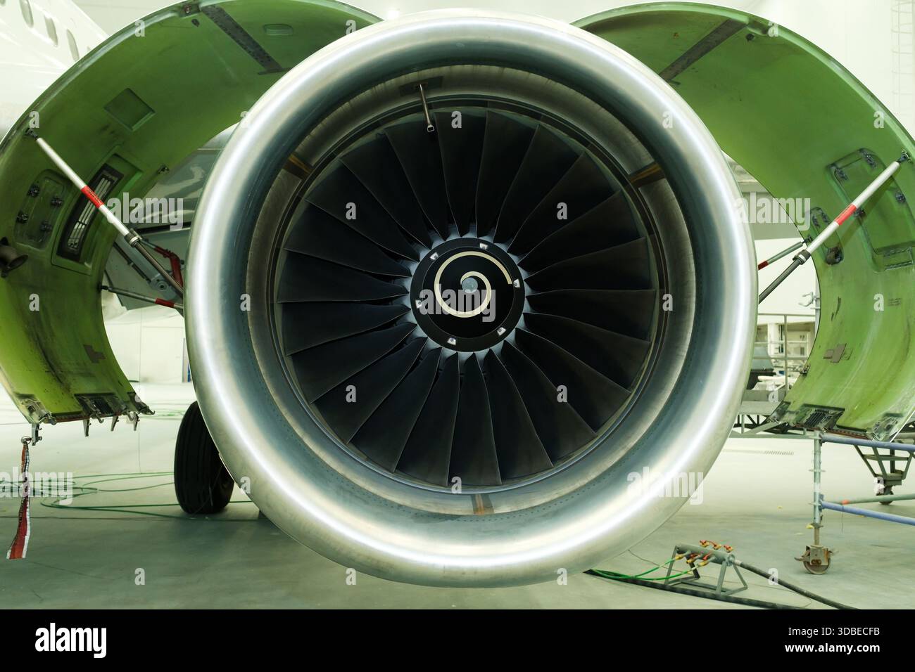 A close-up view reveals the interior of a large aircraft engine ...