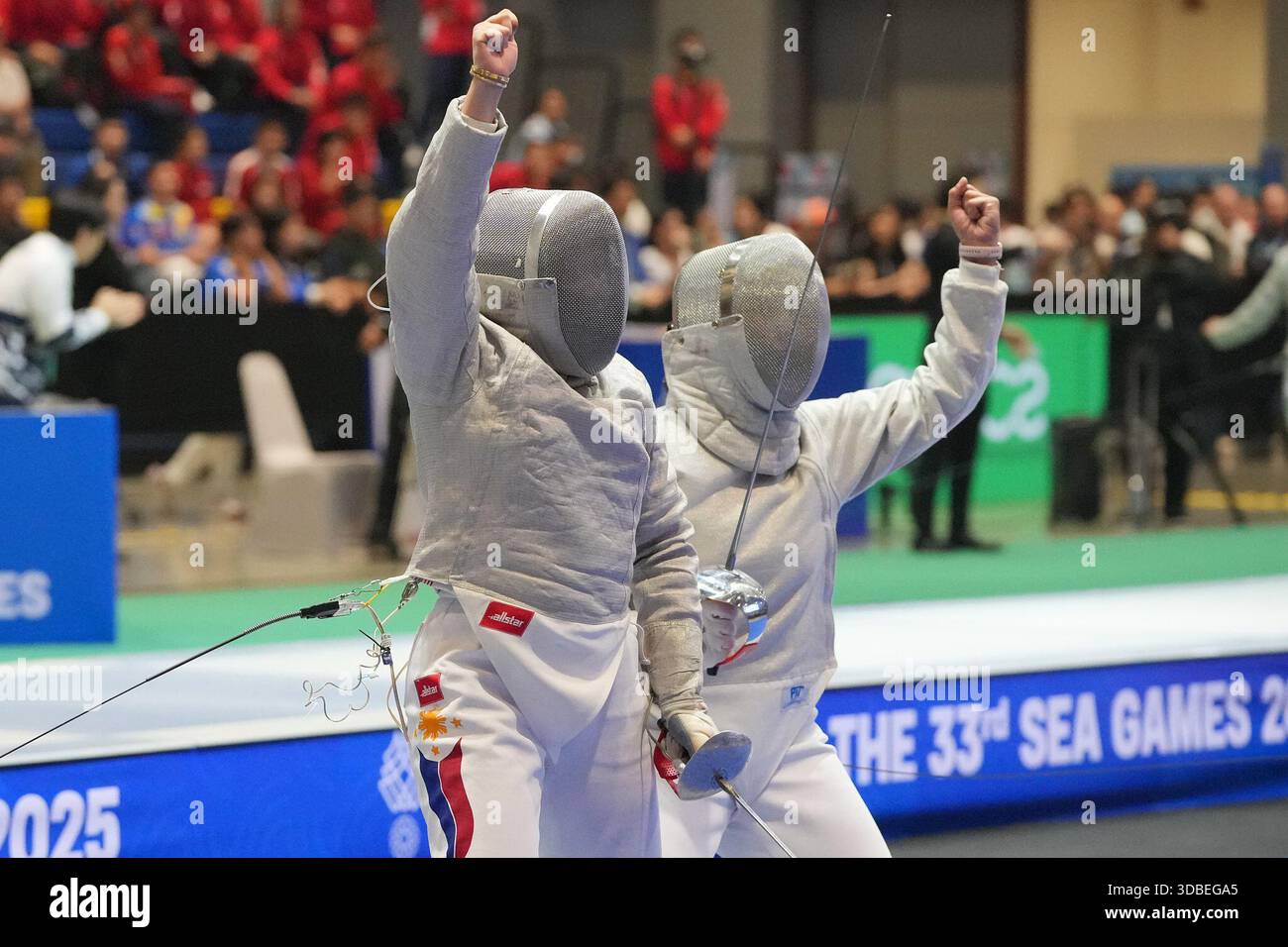 Philipina's Charmaine Grace Andres, left, and Indonesia's Reni Anggraini, right, react during ...