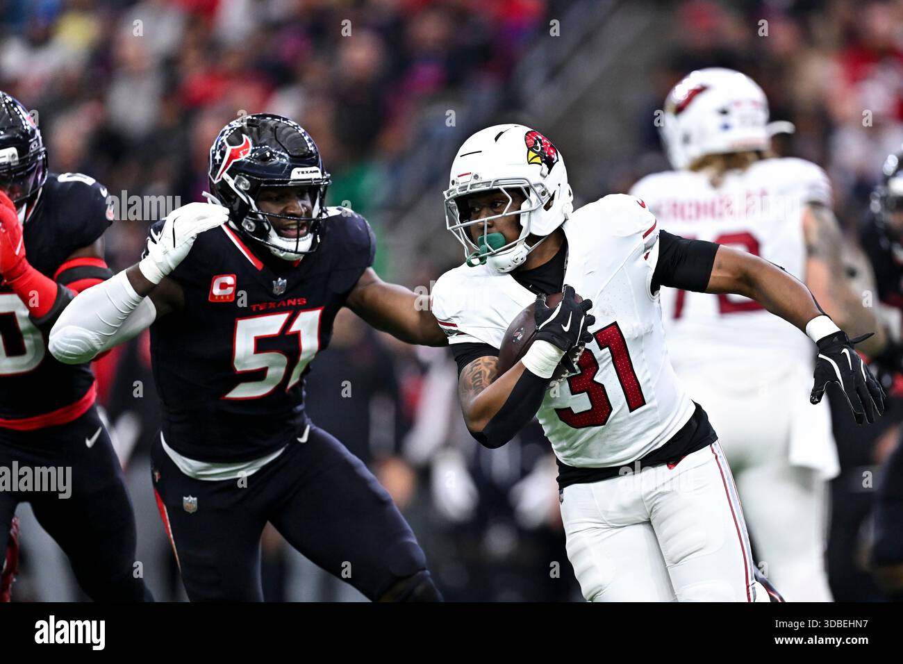 Arizona Cardinals cornerback Garrett Williams (21) runs the ball as ...